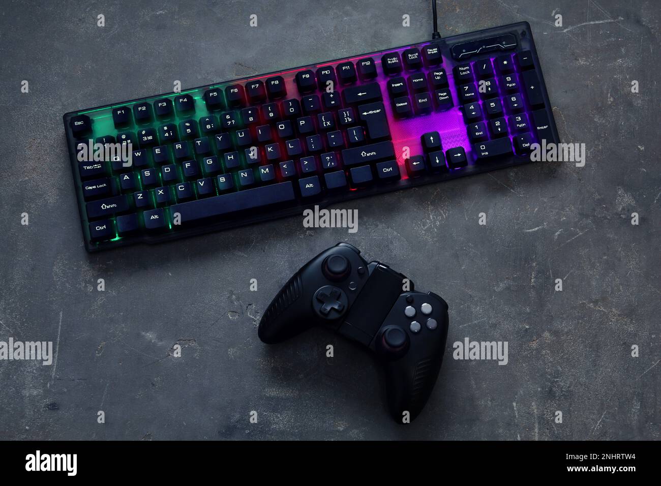 Modern RGB keyboard and game pad on grey table, flat lay Stock Photo ...
