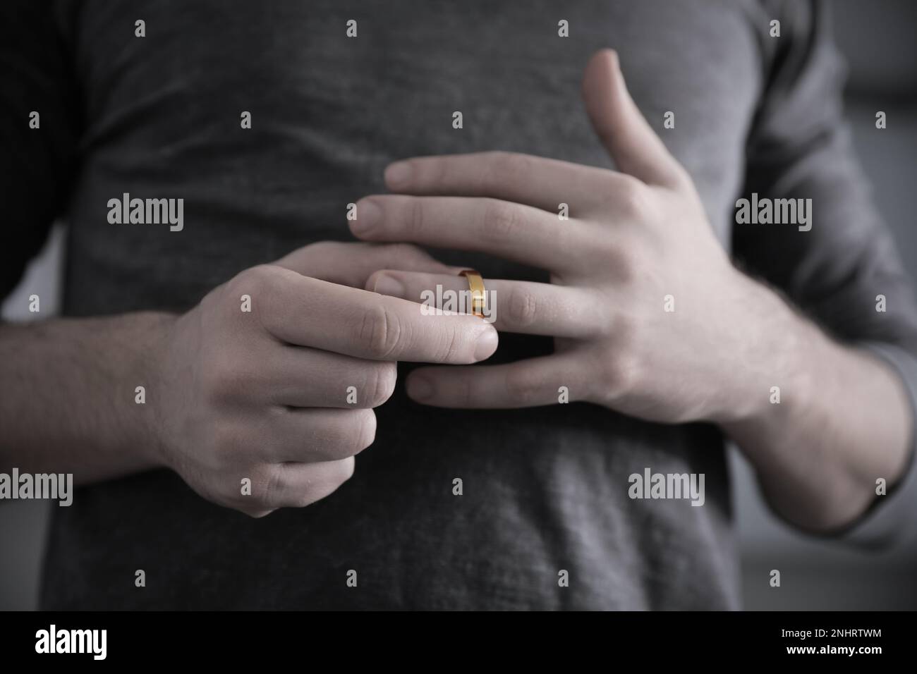 Man taking off wedding ring, closeup. Cheating and breakup Stock Photo ...