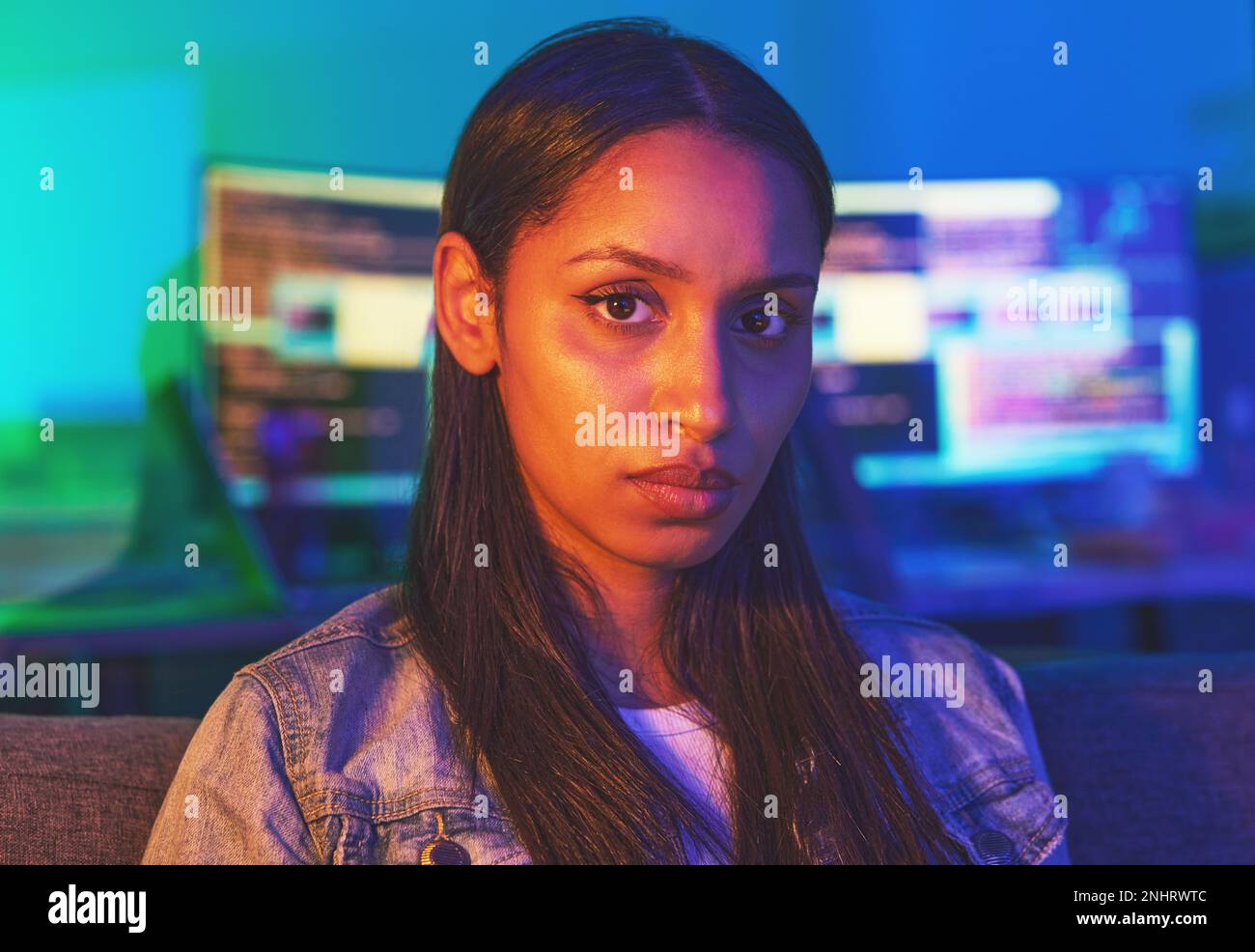 Hacker, portrait or serious face in neon house with cybersecurity ...