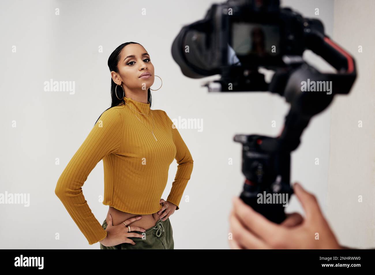 Photography, woman and cameraman or photographer with fashion model in ...