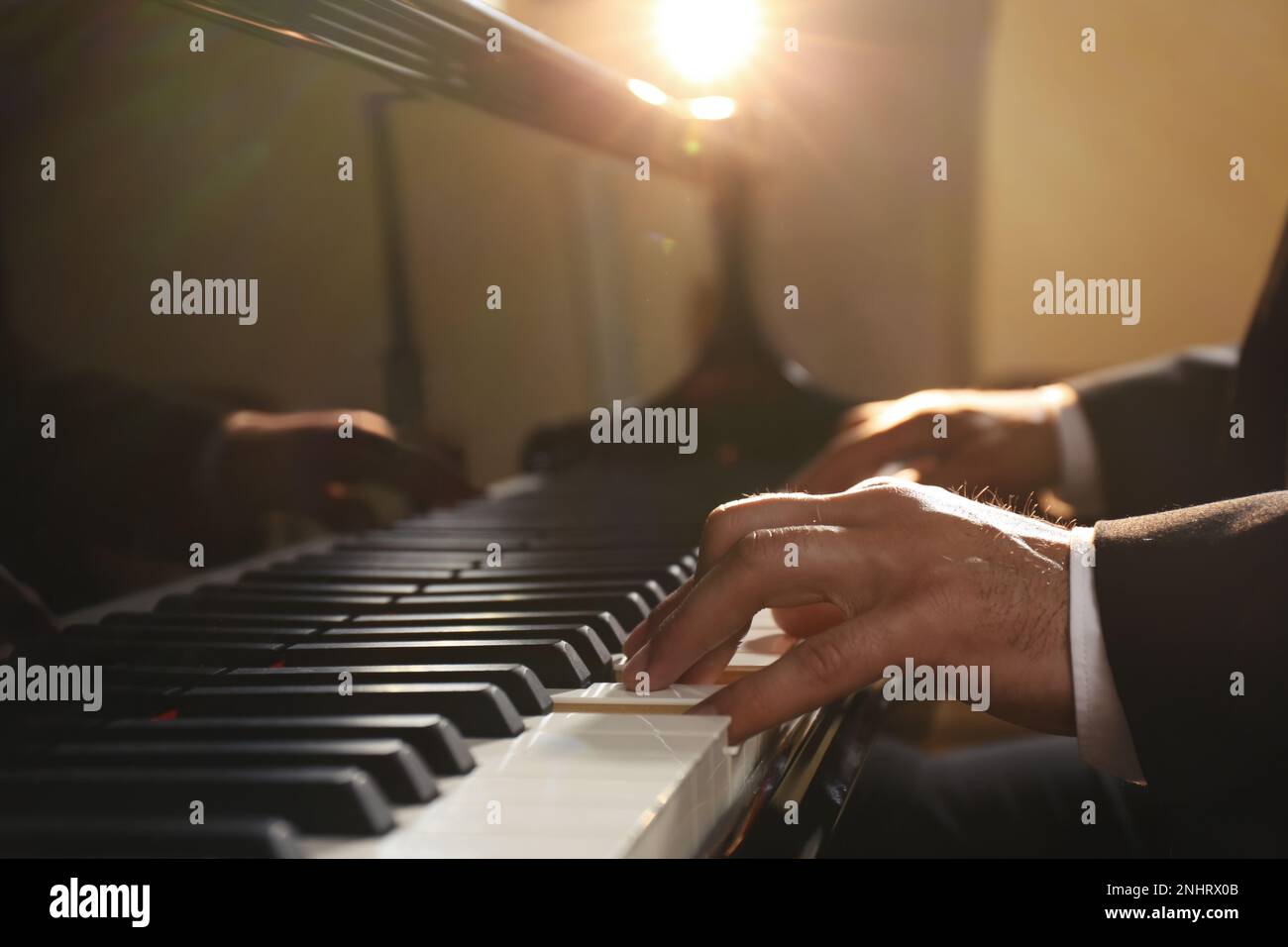 Man playing piano indoors, closeup. Talented musician Stock Photo - Alamy