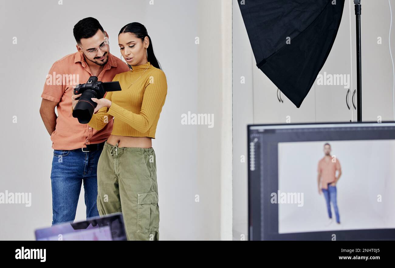 Teamwork, photographer and startup people with camera in studio set for ...