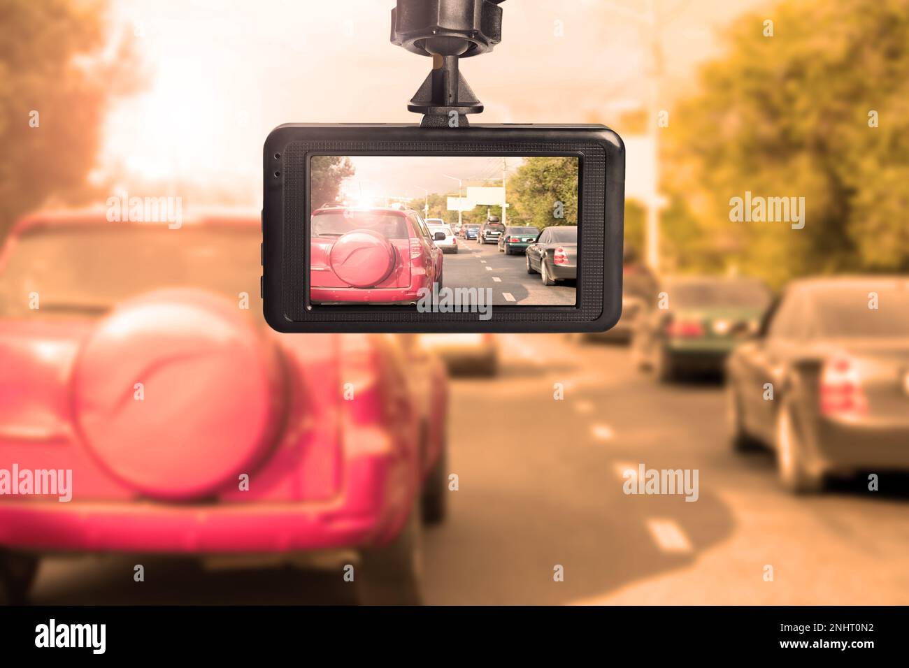 Modern dashboard camera mounted in car, view of road during driving ...