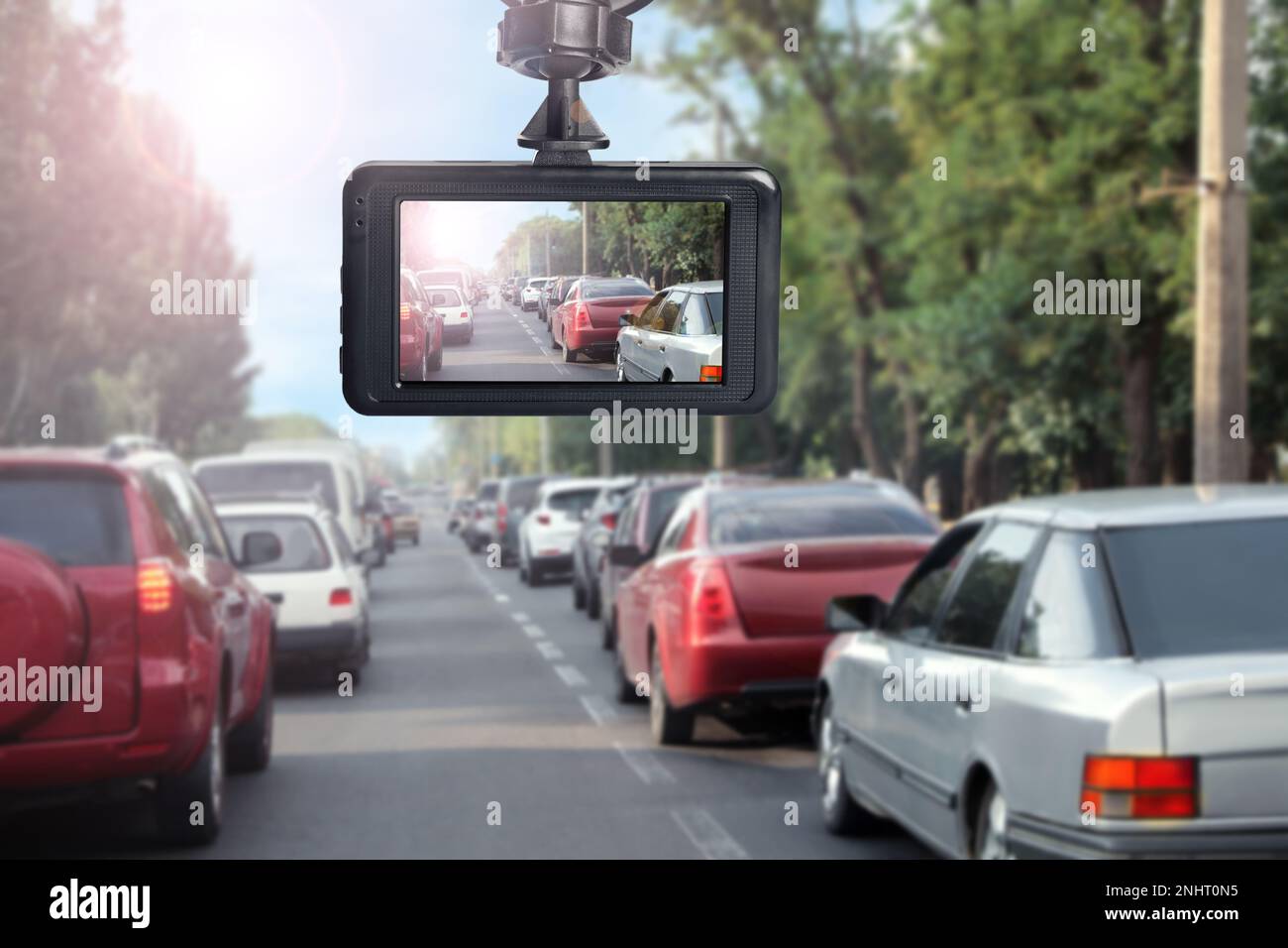 Modern dashboard camera mounted in car, view of road during driving ...