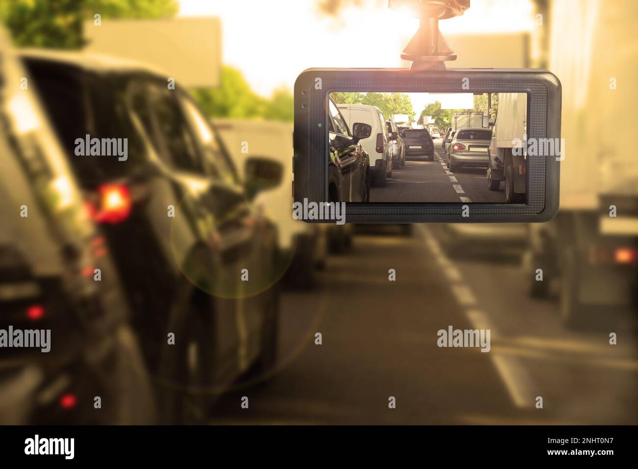 Modern dashboard camera mounted in car, view of road during driving ...
