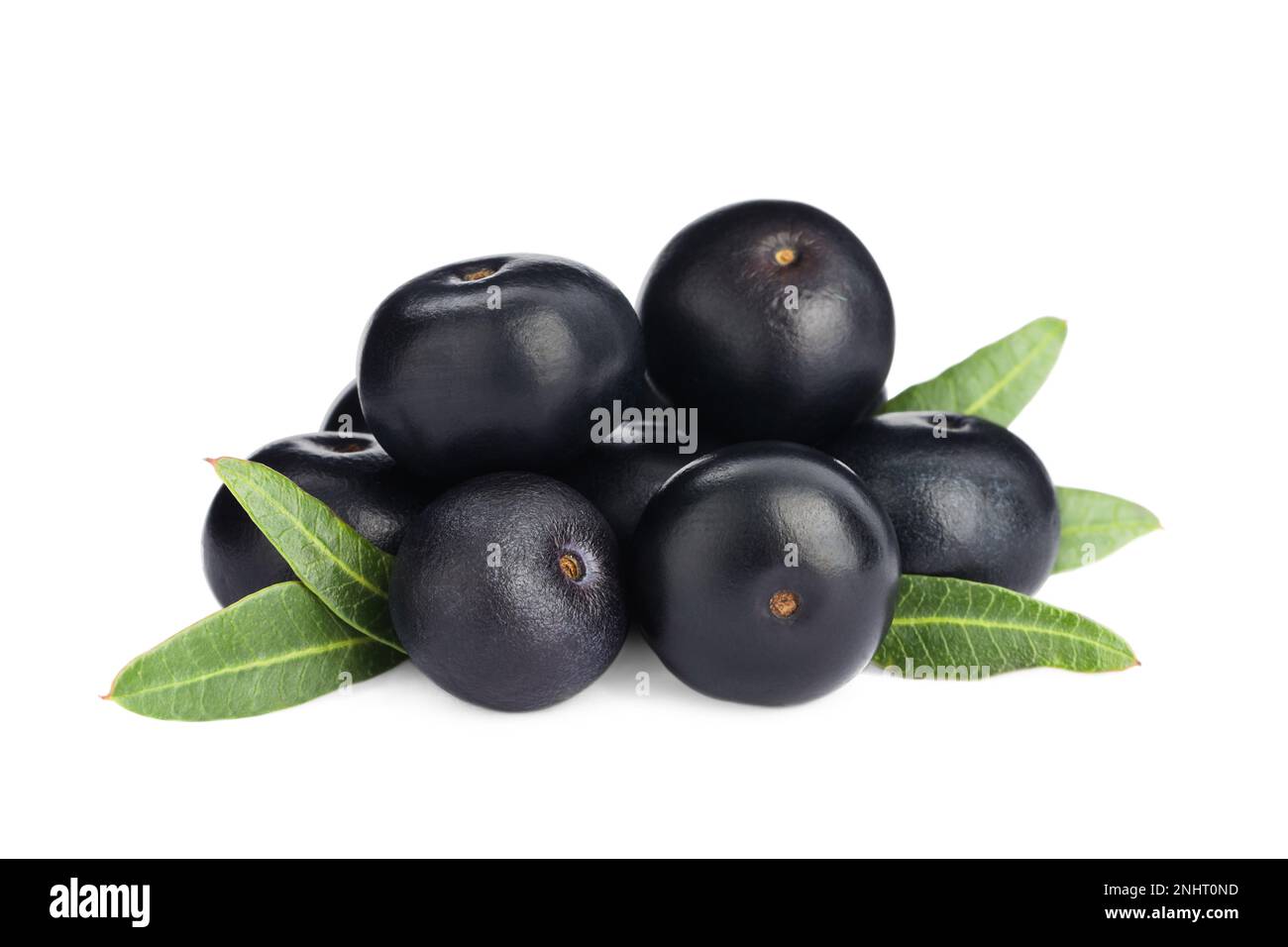 Pile of fresh ripe acai berries and green leaves on white background ...