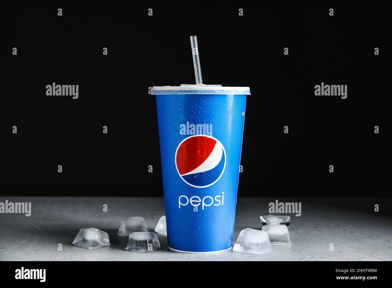 MYKOLAIV, UKRAINE - JUNE 9, 2021: Paper Pepsi cup and ice cubes on ...