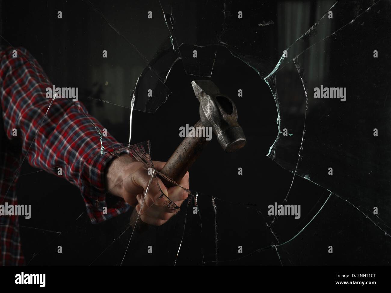 Man breaking window with hammer on black background, closeup Stock ...