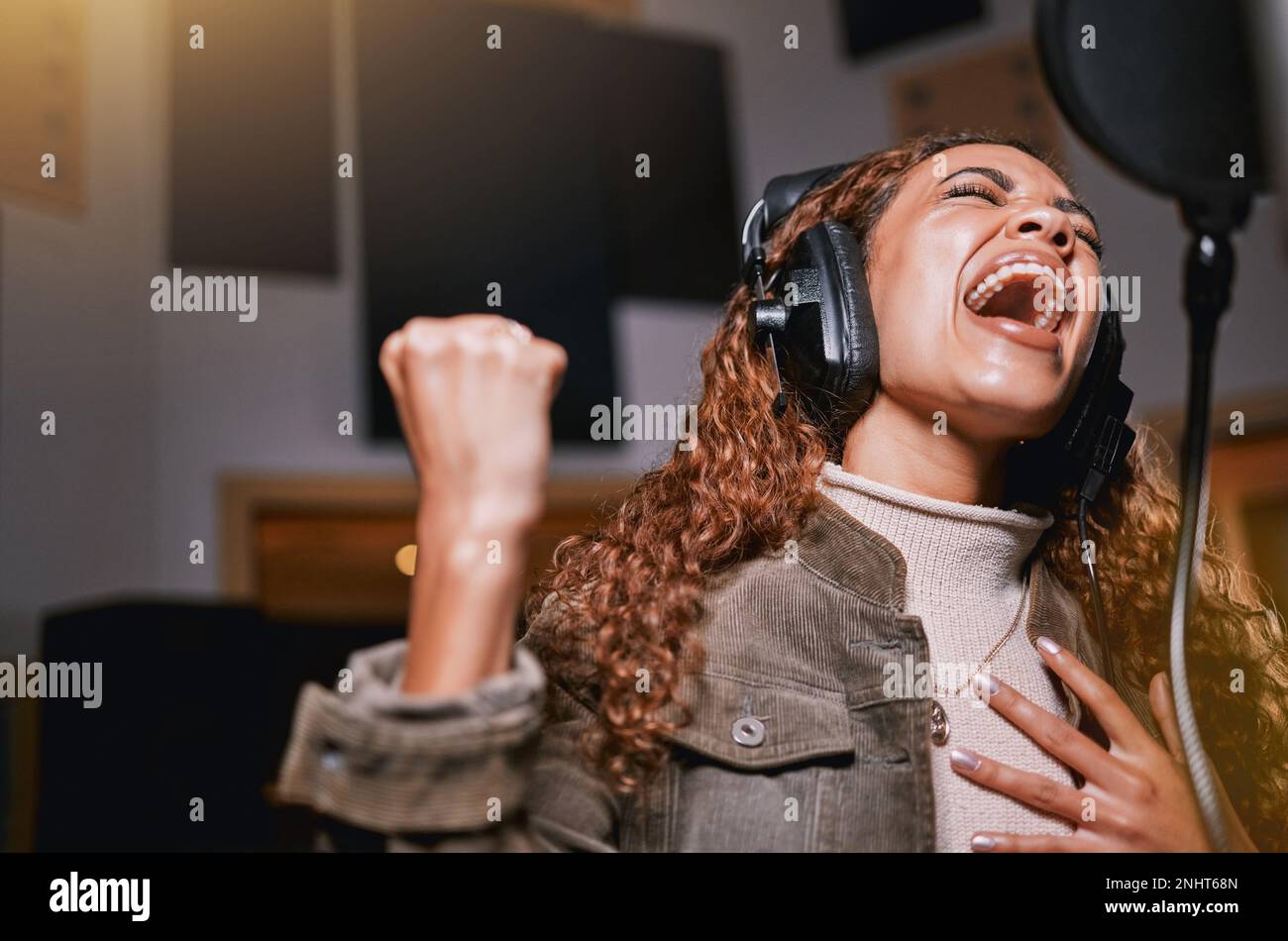 Music, singing and recording studio with a black woman celebrity at her ...