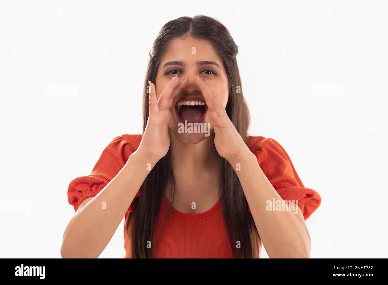 Portrait of beautiful woman shouting against white background Stock ...