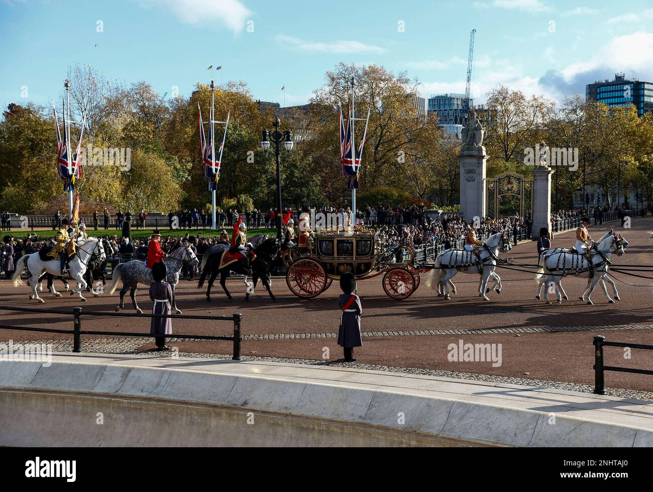 A procession leading a state carriage containing Britain's King Charles ...