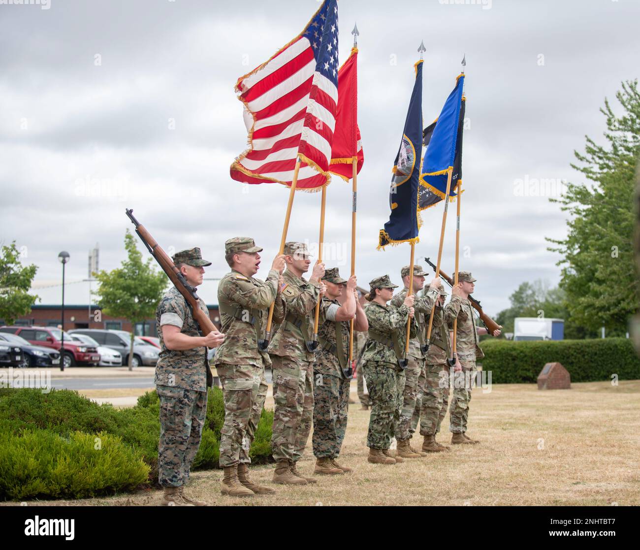 A joint-service color guard presents the colors during a ceremony at ...