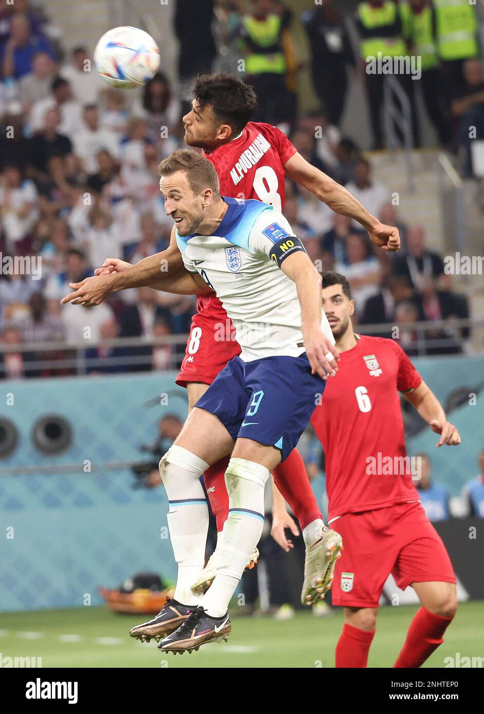 England's Harry Kane (L) fights for the ball against Iran's Morteza ...