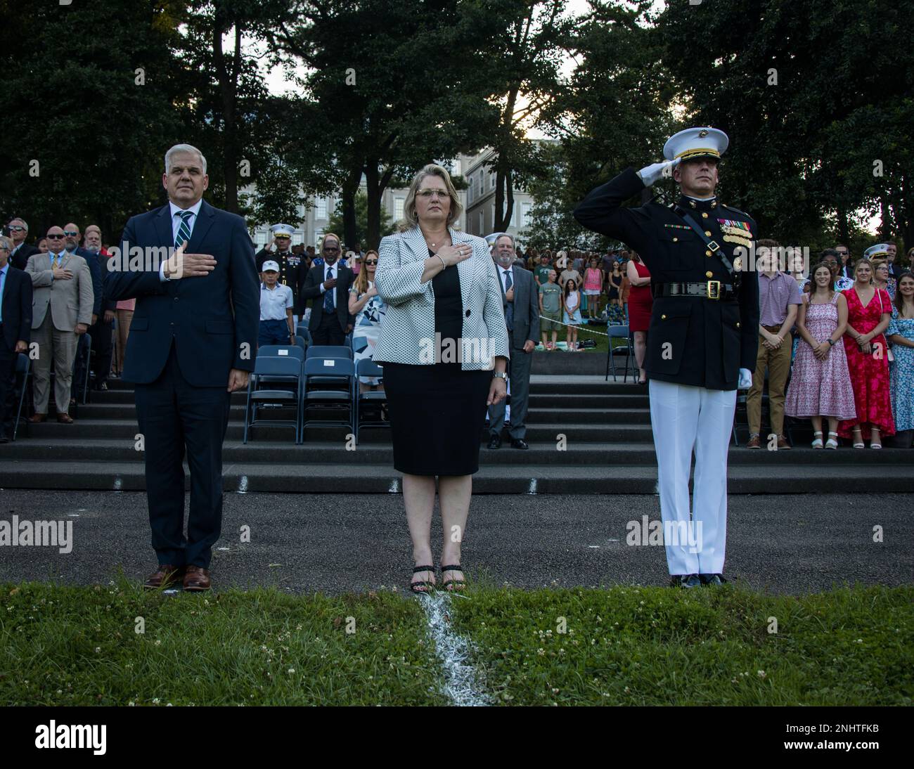 The official party stands for “honors” during a Sunset Parade at the ...
