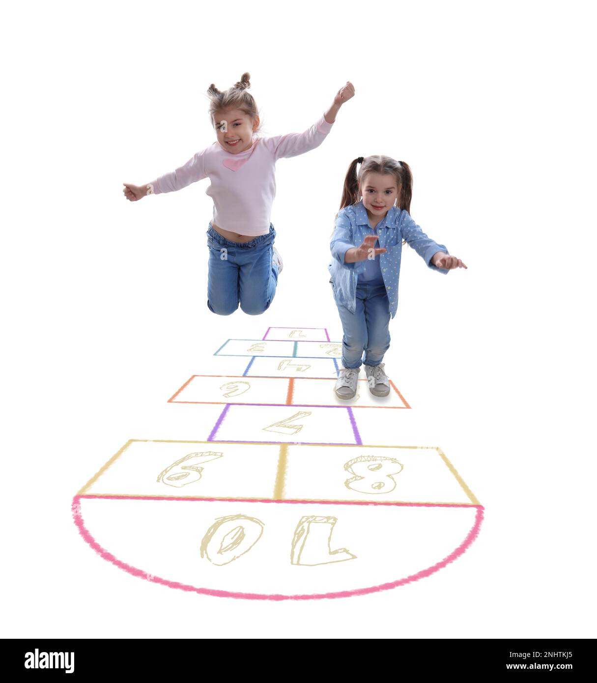 Cute little girls playing hopscotch on white background Stock Photo - Alamy