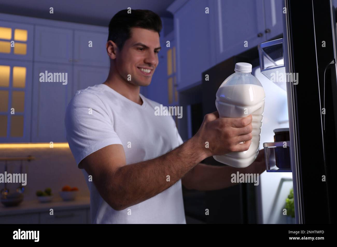 Man holding gallon bottle hi-res stock photography and images - Alamy