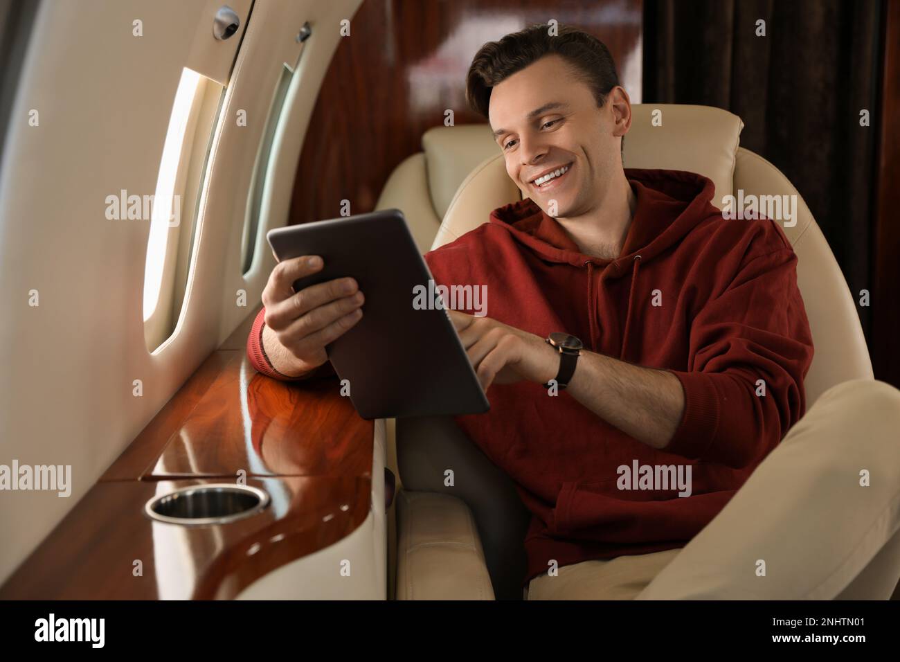Young guy sitting in flight hi-res stock photography and images - Alamy
