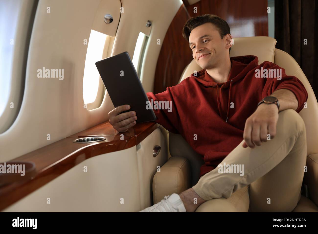 Young guy sitting in flight hi-res stock photography and images - Alamy
