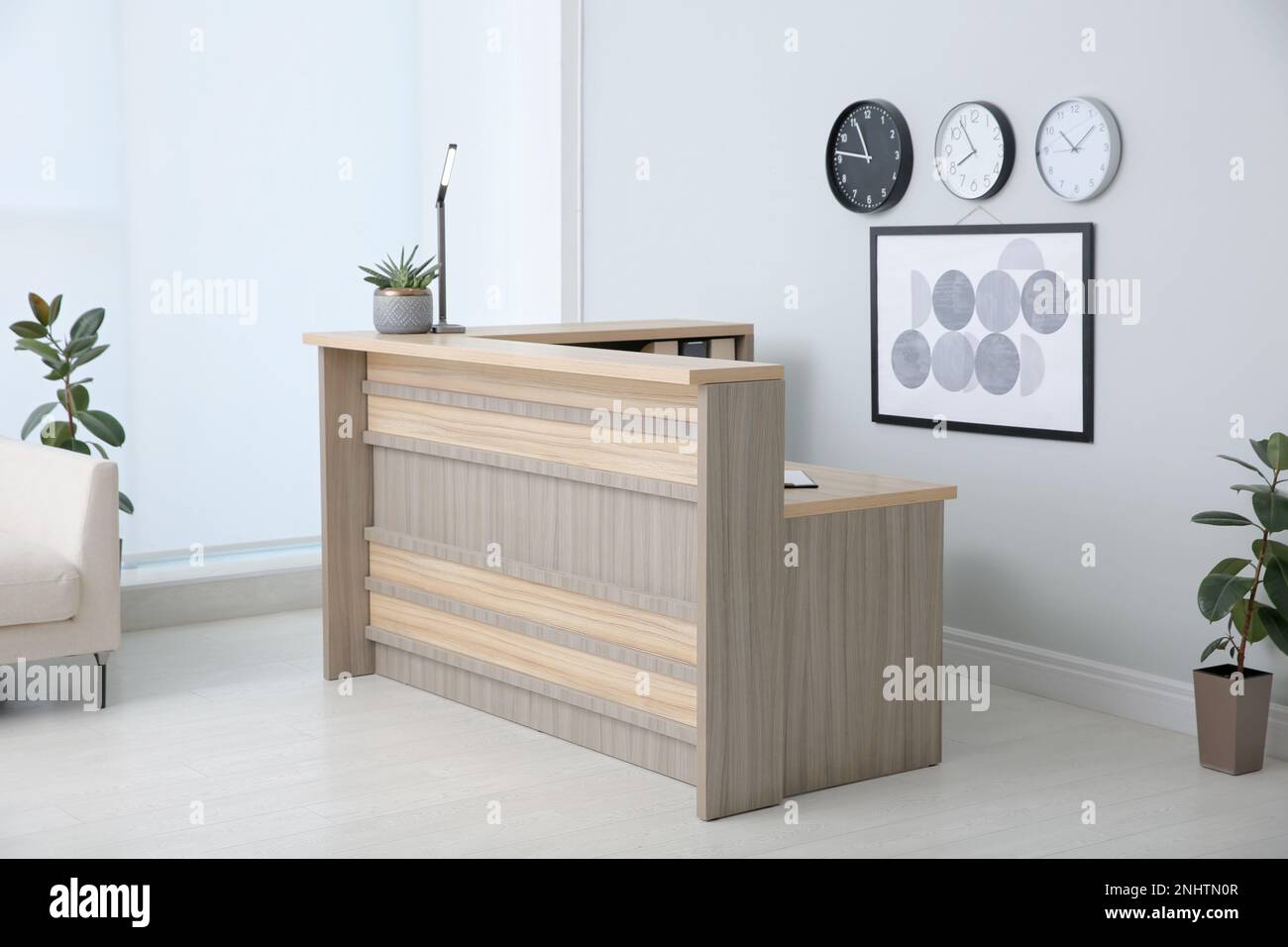 Lobby interior with stylish wooden receptionist desk Stock Photo - Alamy