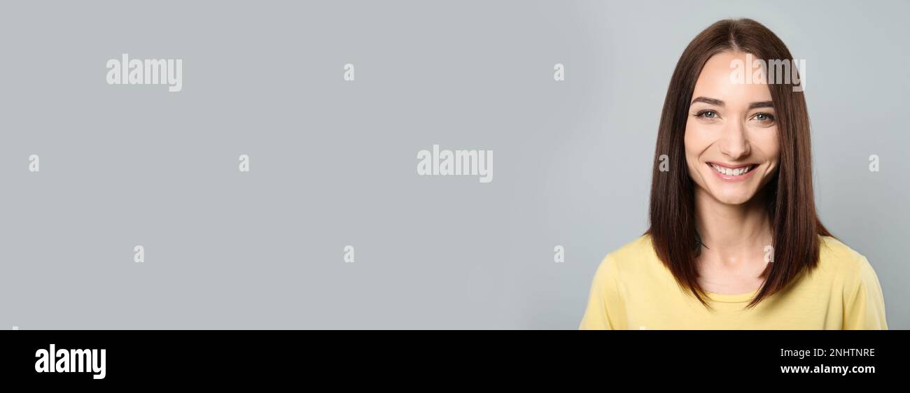Portrait of pretty young woman with gorgeous chestnut hair and charming ...