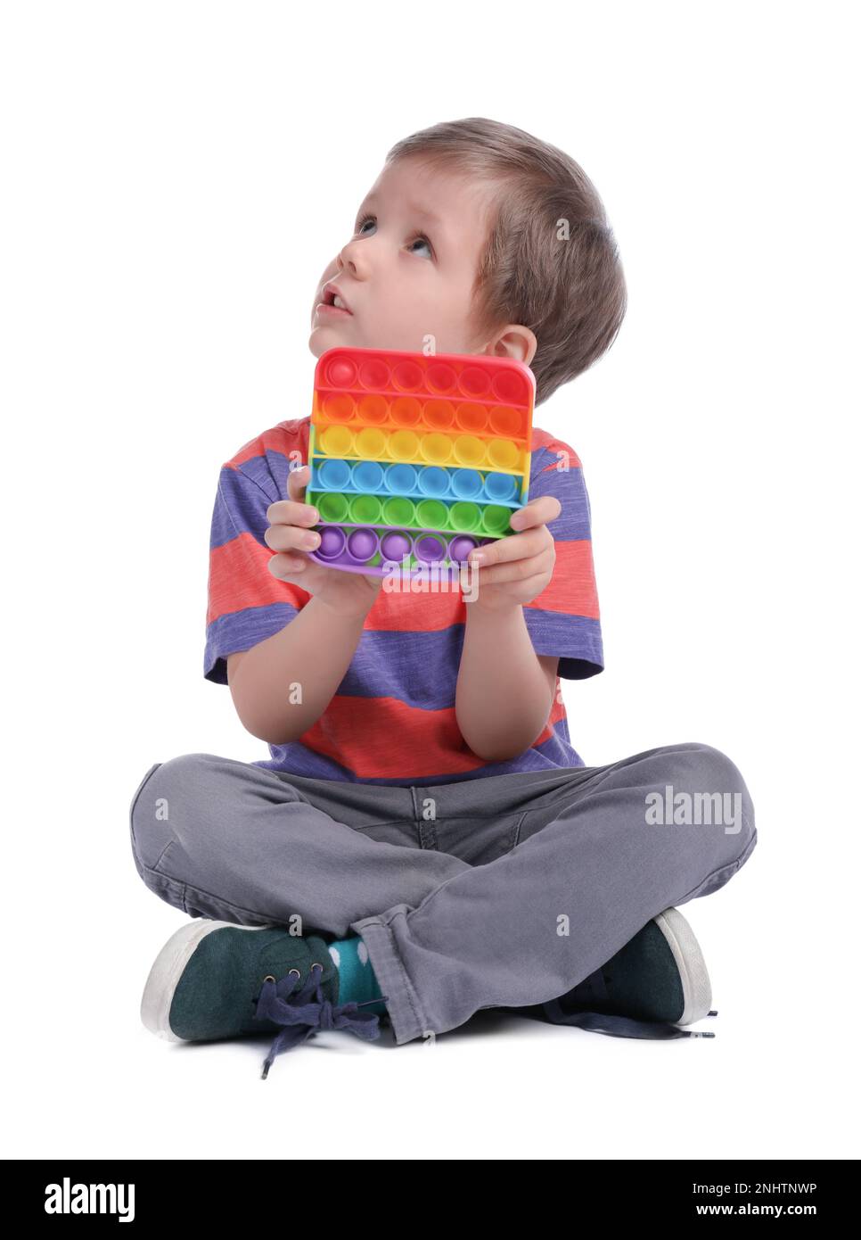 Little boy with pop it fidget toy on white background Stock Photo - Alamy