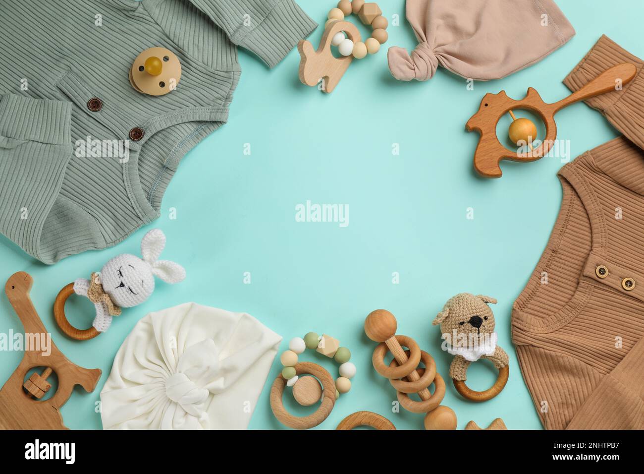 Frame of baby clothes and accessories on light blue background, flat ...