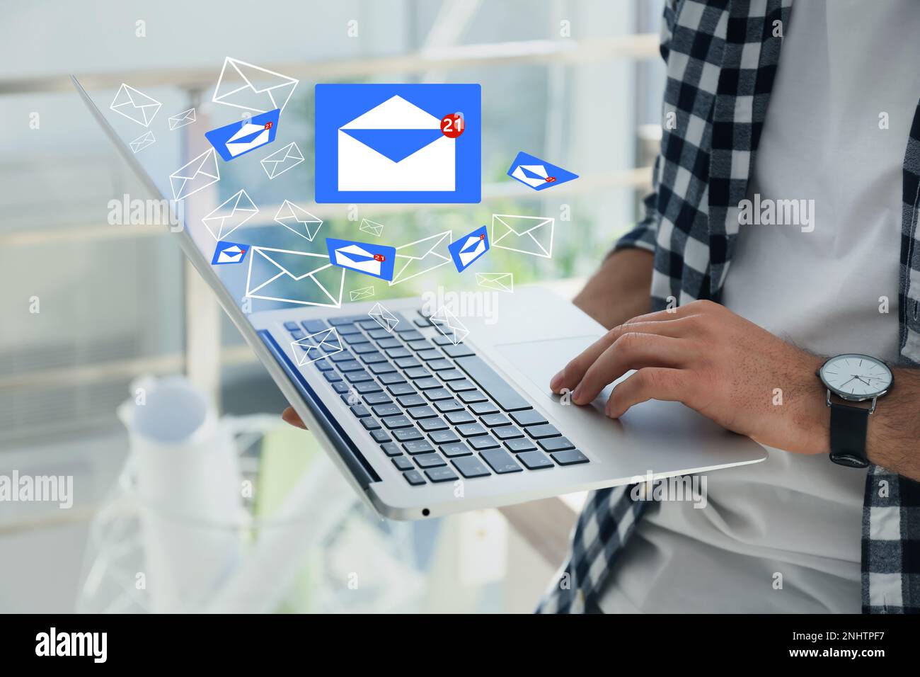 Man sending emails via laptop at home, closeup Stock Photo - Alamy