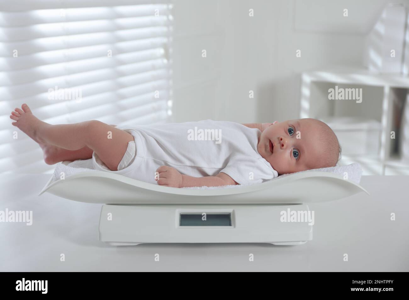 Child weighing scale clinic hi-res stock photography and images - Alamy