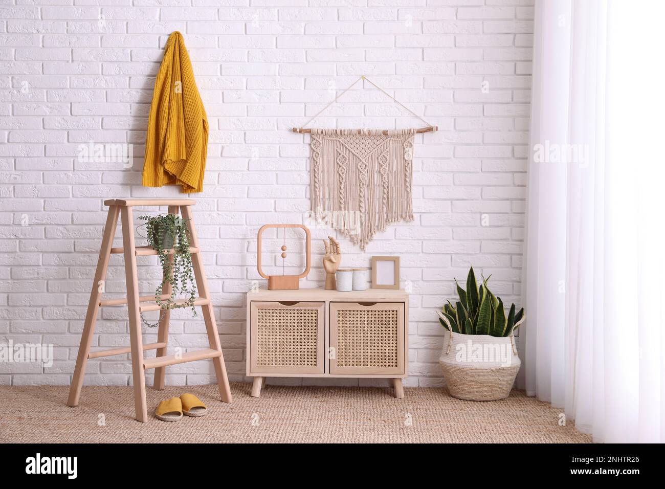 Modern room with wooden commode. Interior design Stock Photo - Alamy