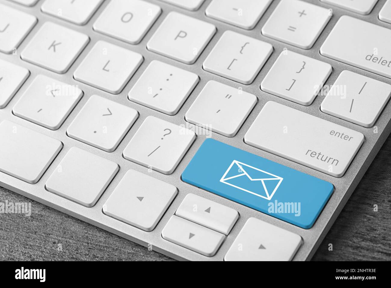 Modern computer keyboard with envelope sign on button, closeup view ...