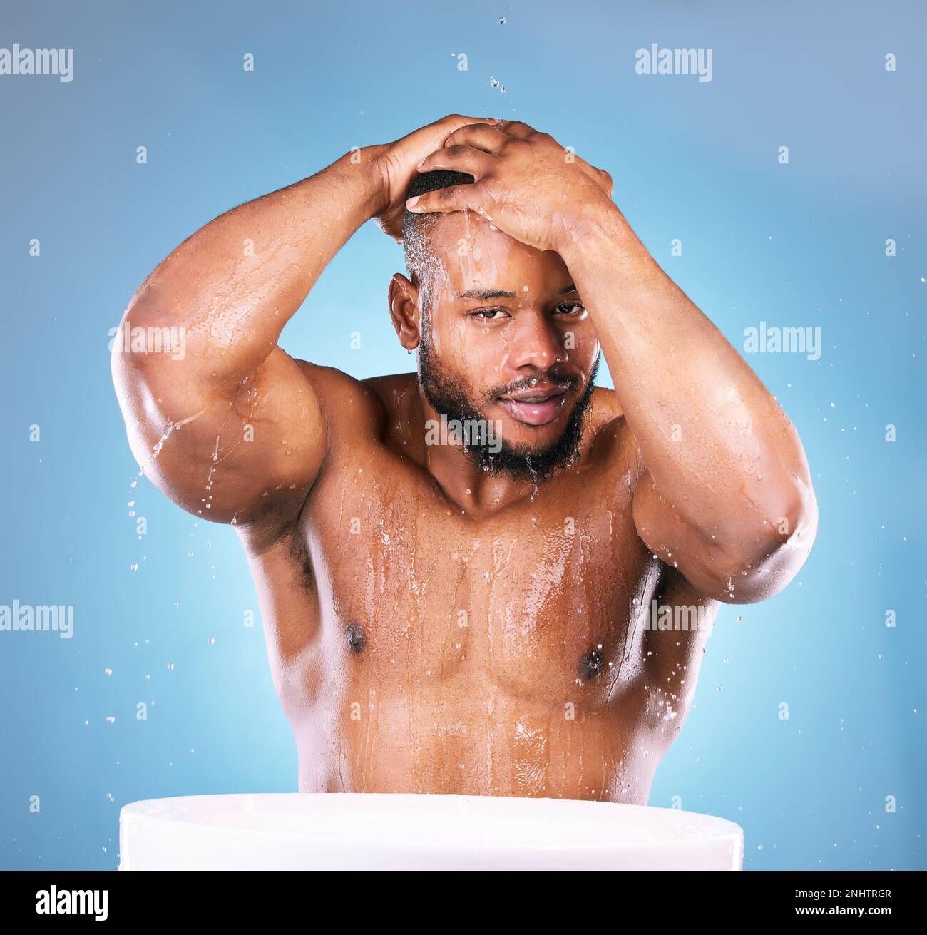 Water, portrait or black man cleaning face or body for skincare, fresh clean hygiene on studio ...