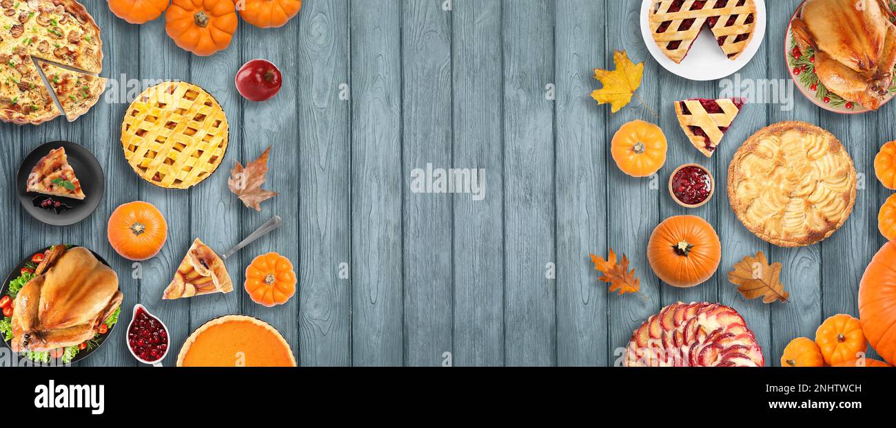 Flat lay composition with different tasty pies on wooden table, space ...