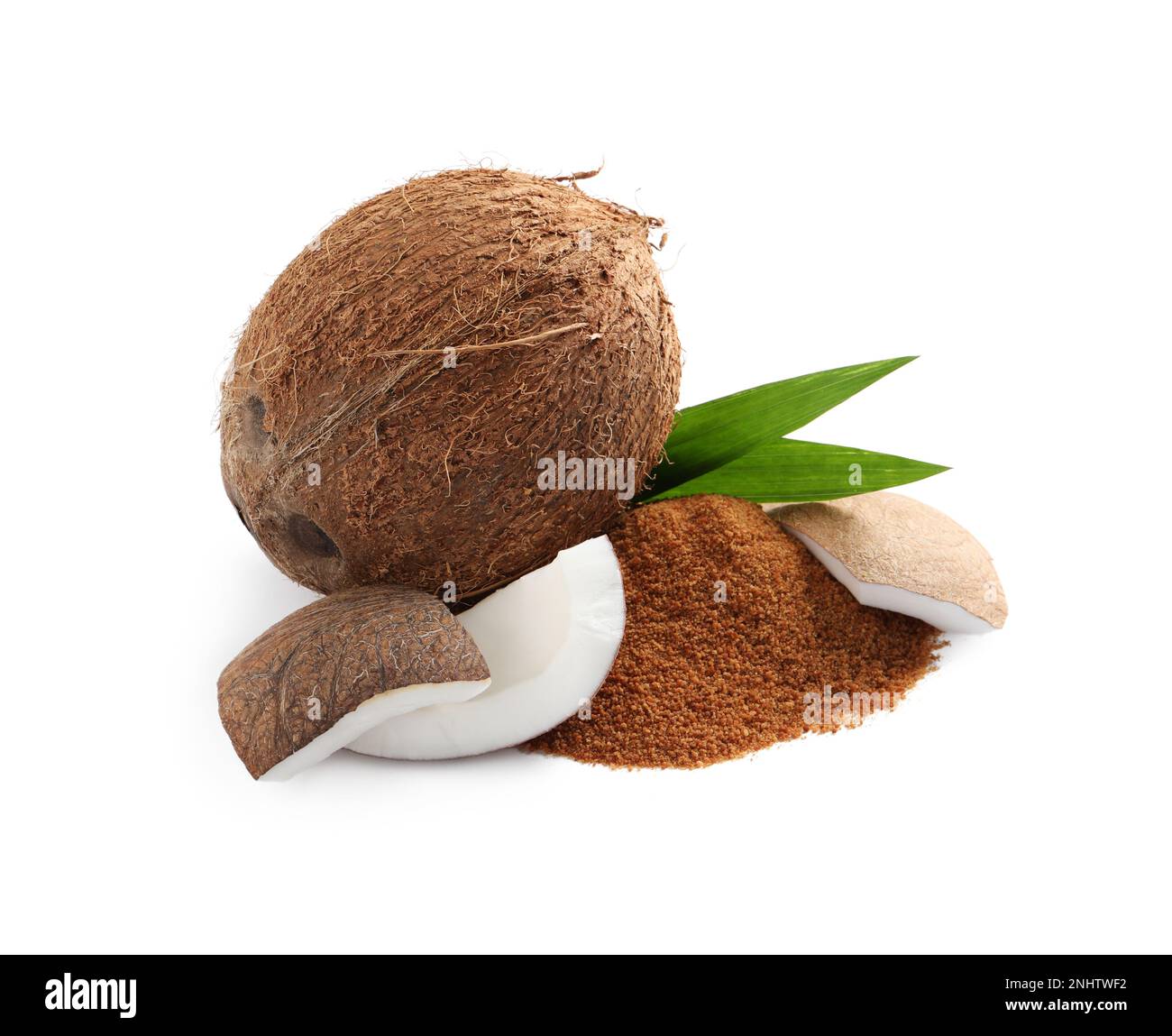 Ripe coconuts and pile of brown sugar on white background Stock Photo ...