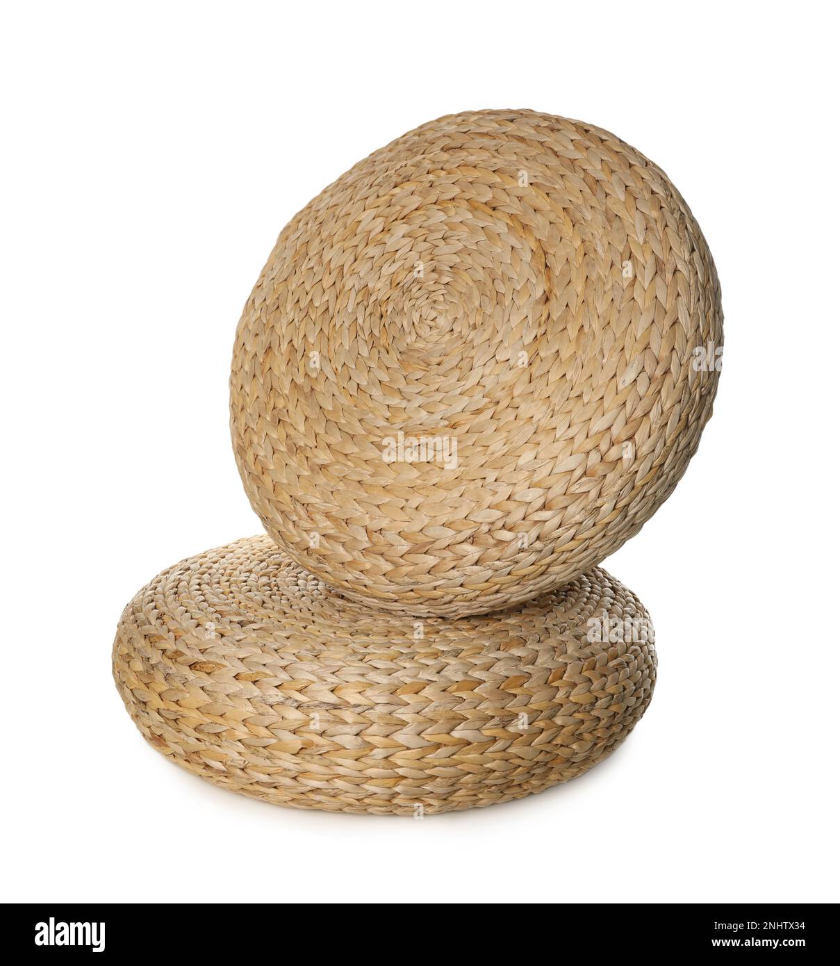 Two stylish wicker poufs on white background Stock Photo - Alamy