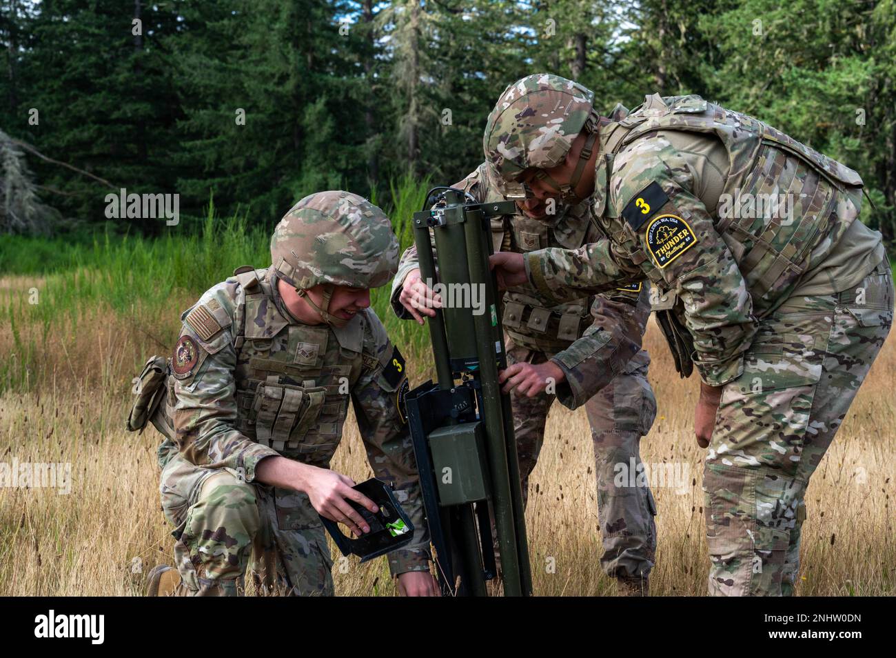 U.S. Air Force Senior Airmen Tyler Seher, left, Staff Sgt. Joshua ...