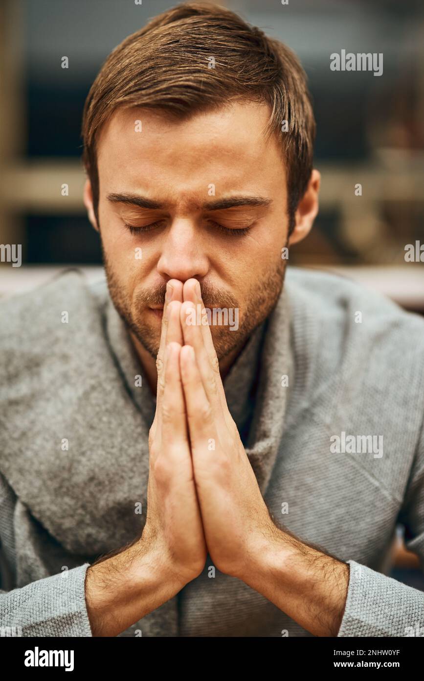 Young people praying at a table hi-res stock photography and images - Alamy