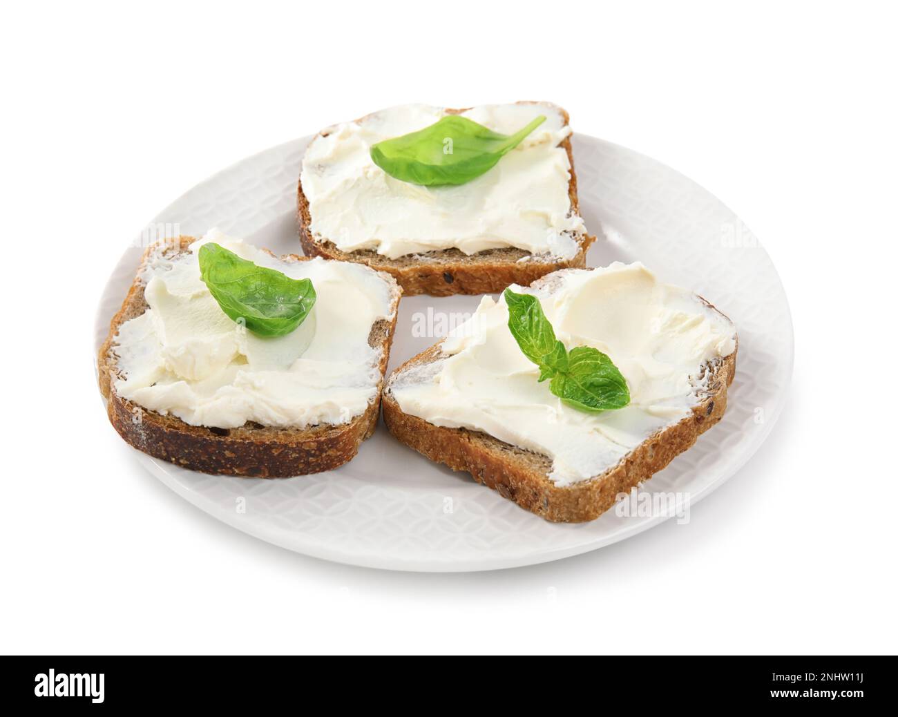 Bread with cream cheese and basil on white background Stock Photo - Alamy