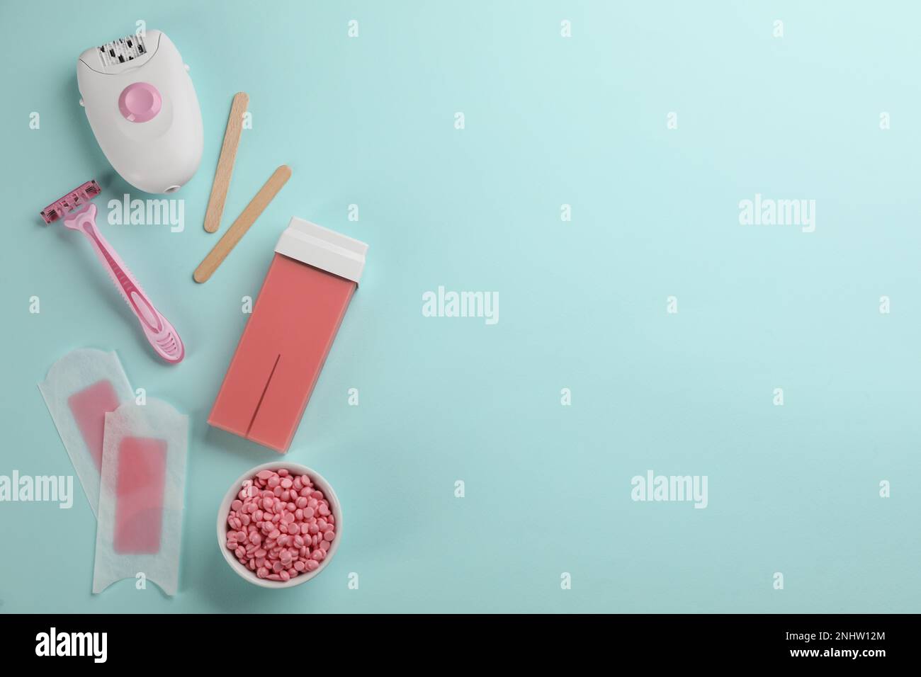 Set of epilation tools and products on turquoise background, flat lay ...