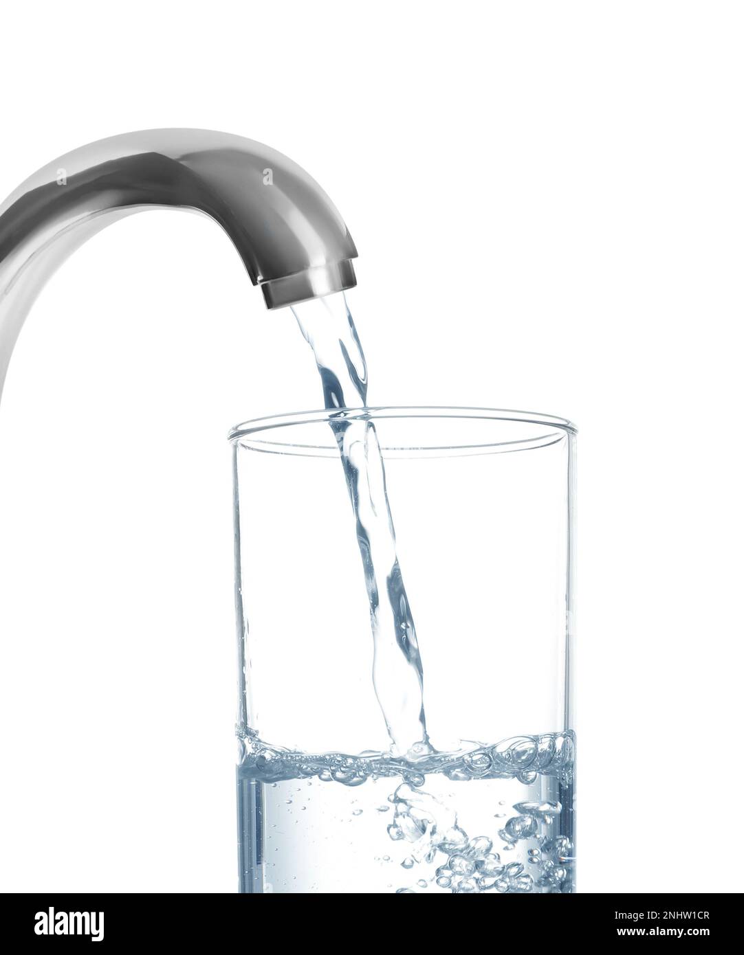 Filling glass with water from tap on white background Stock Photo - Alamy