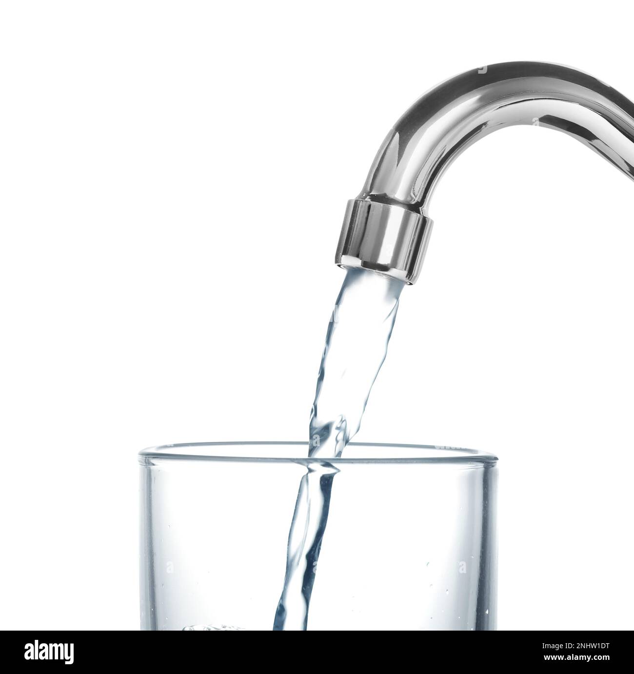 Filling glass with water from tap on white background Stock Photo - Alamy
