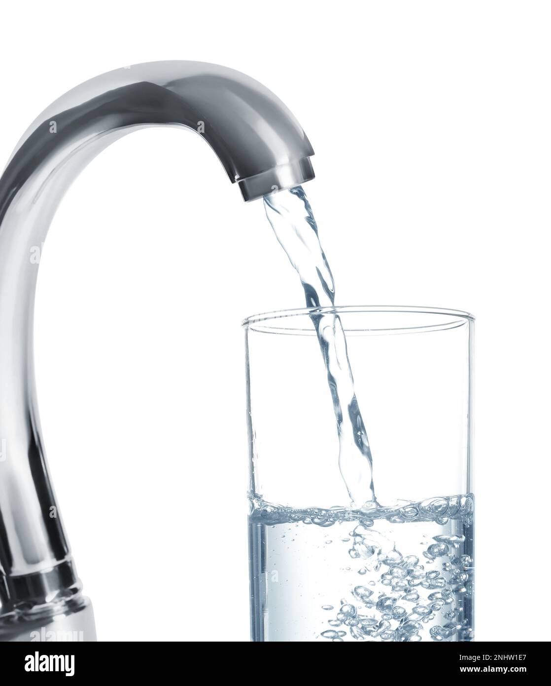 Filling glass with water from tap on white background Stock Photo - Alamy