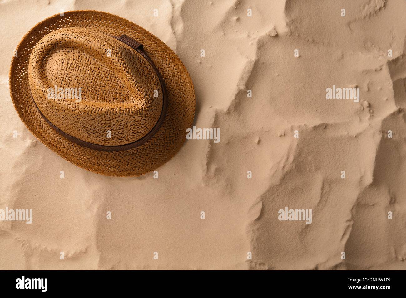 Stylish straw hat on sand, top view. Space for text Stock Photo - Alamy