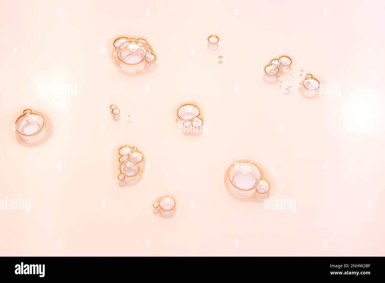 Glycerin gel texture. Transparent serum toner drop on pink background ...