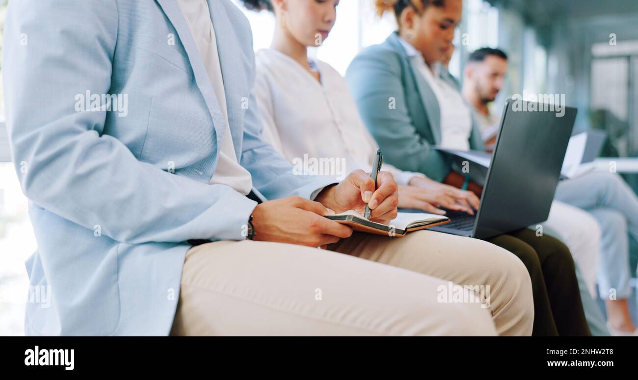 Recruitment, row and business people writing in notebook for hiring ...