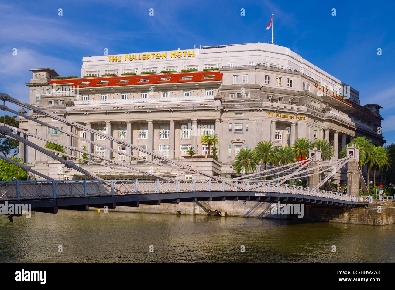 The Fullerton Hotel and Cavenagh Bridge on the SIngapore River in ...