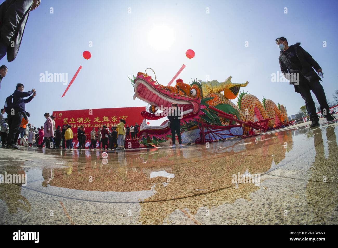 People participate in a parade carrying an 88-meter-long dragon for ...