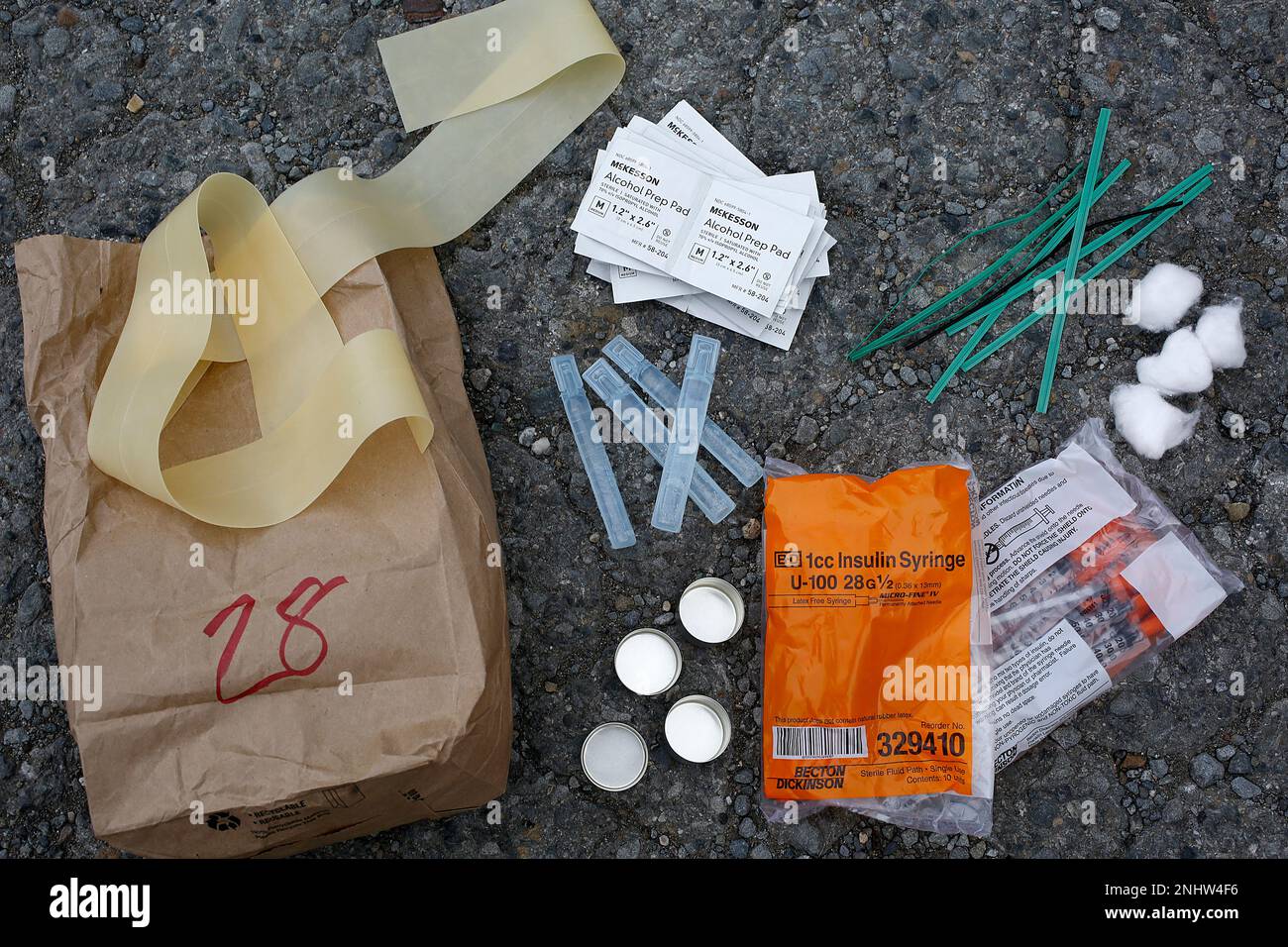 The contents of a bag from the city's needle exchange program seen in ...