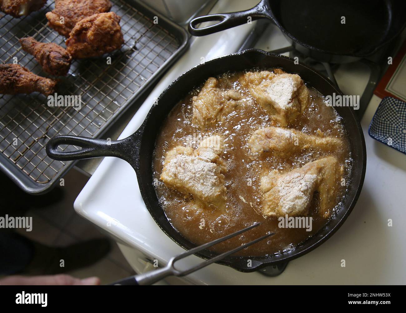 Sarah Rich shows how she fries Sally Hurricane's southern fried chicken ...
