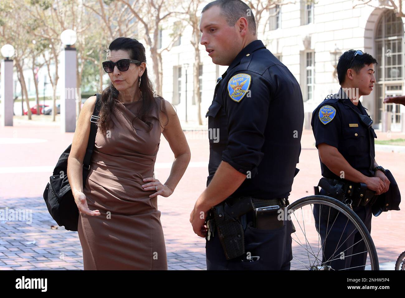 Erica Sandberg talks with police officer Cuadro at the San Francisco's ...
