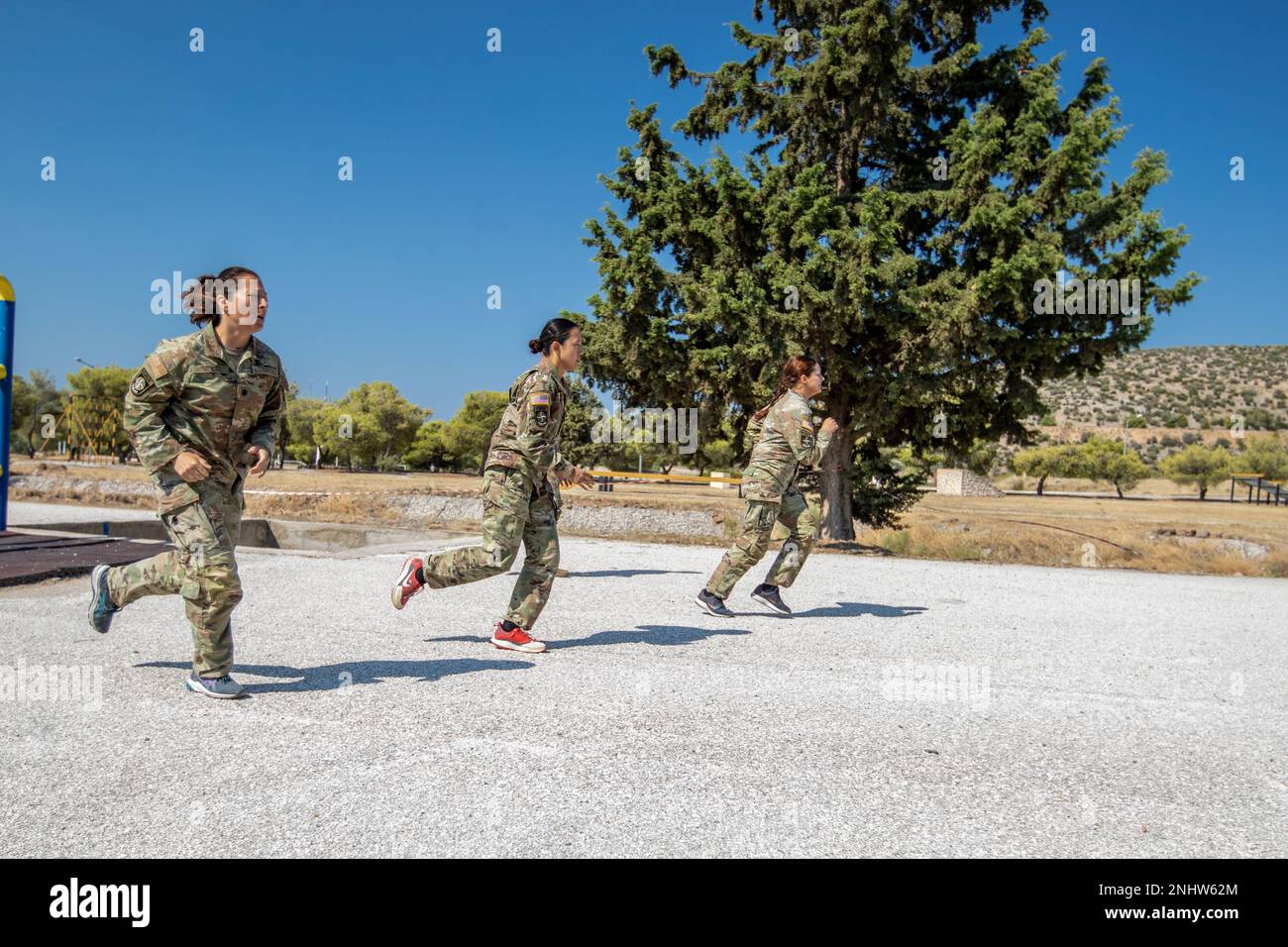 A U.S. CIOR 2022 team run together through the obstacle course in ...